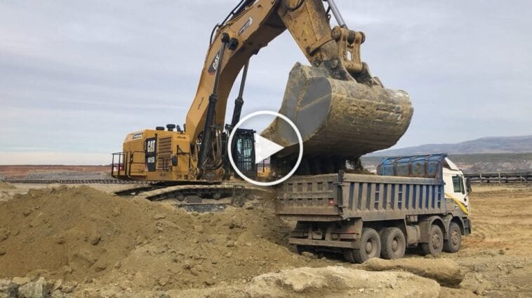 Gigantic Caterpillar 797B on the road- a vehicule that is impossible to ...