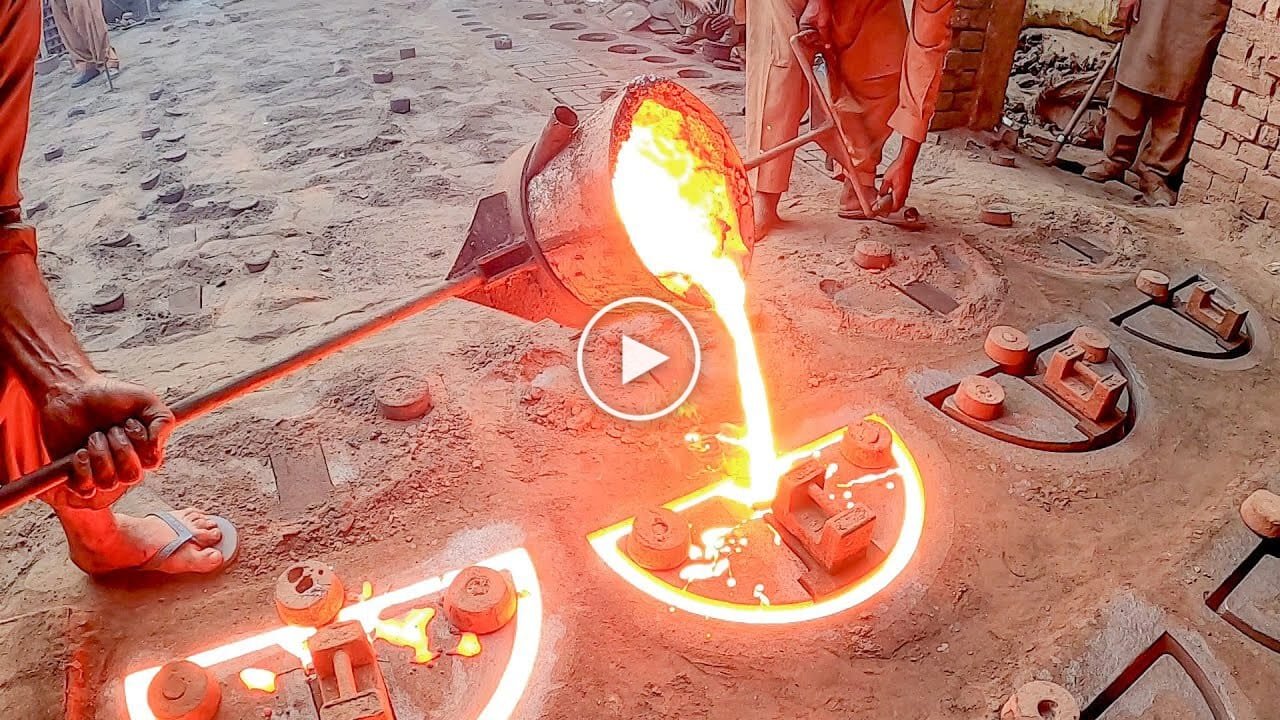 Primitive technology. Casting a metal part in a metallurgical factory ...